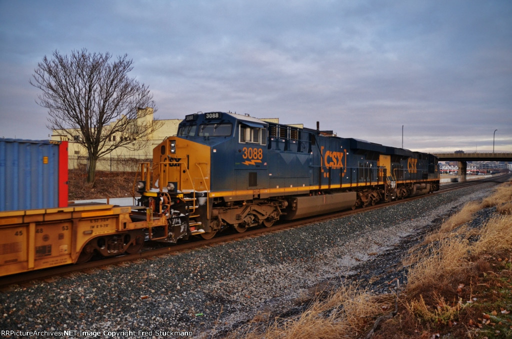 CSX 3088 watches the train.